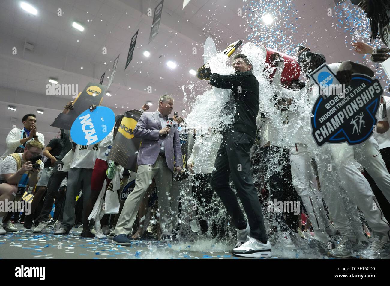 Arkansas coach Doug Case is doused after the Razorbacks won the men's ...