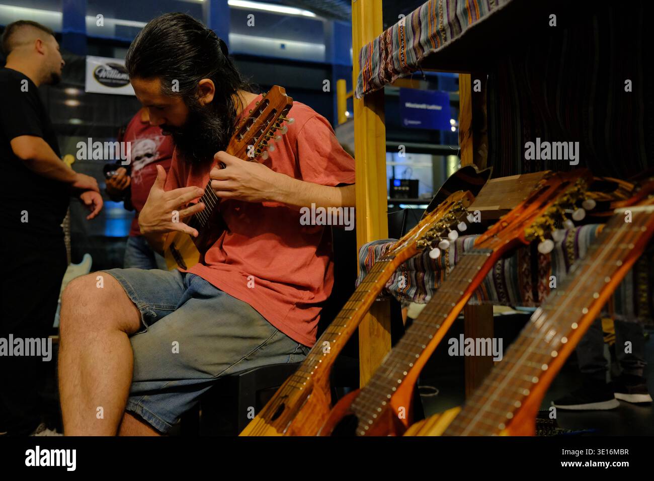 Buenos Aires, Argentina. 14th Mar, 2026. A craftsman tests a musical ...