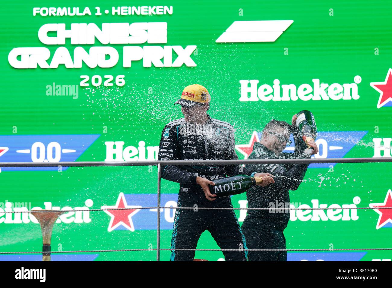 Mercedes’ Kimi Antonelli spraying champaign on the podium after coming ...