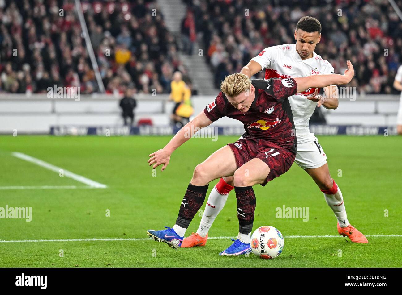Stuttgart's Luca Jaquez and Leipzig's Conrad Harder, left, fight for ...