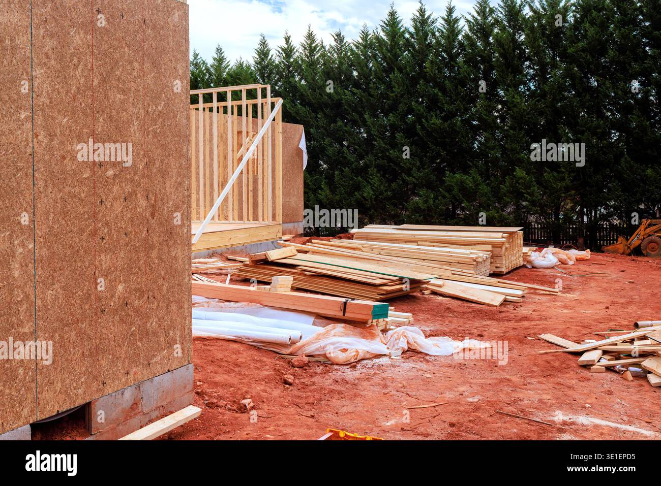 Wooden plywood boards construction materials are spread out at building ...