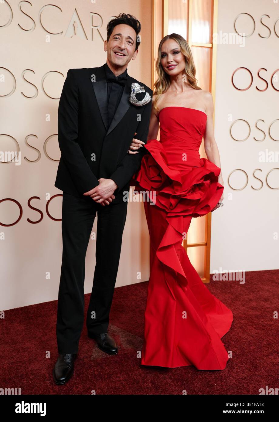 Adrien Brody and Georgina Chapman arrive at the Oscars on Sunday, March ...