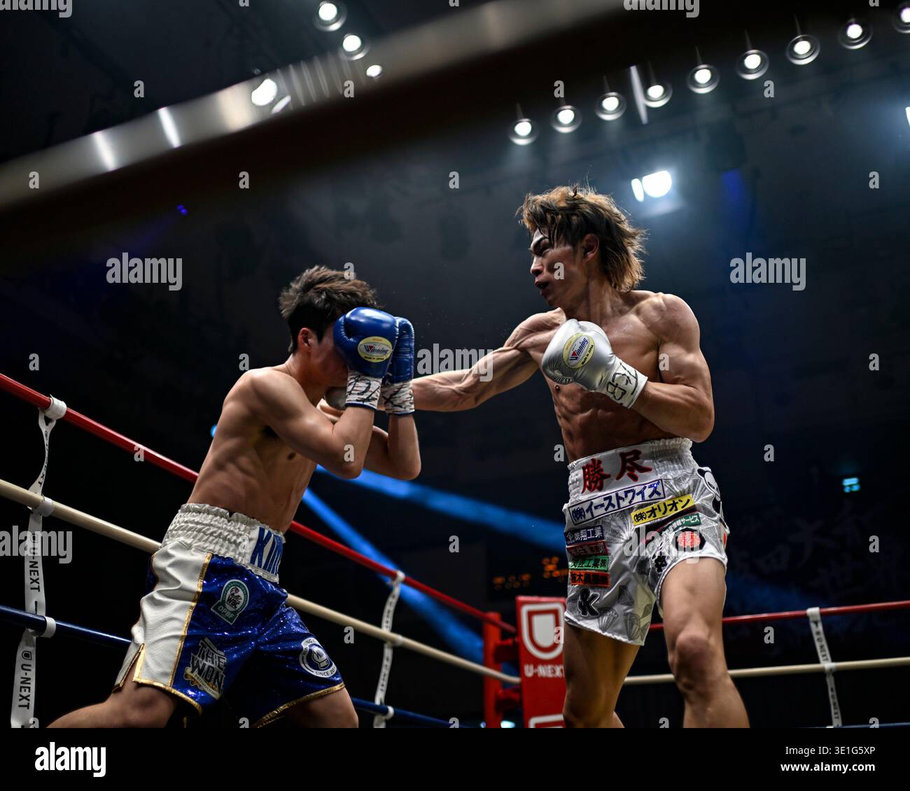 Champion Yamato Hata (silver gloves) of Japan and challenger Tae Sun ...