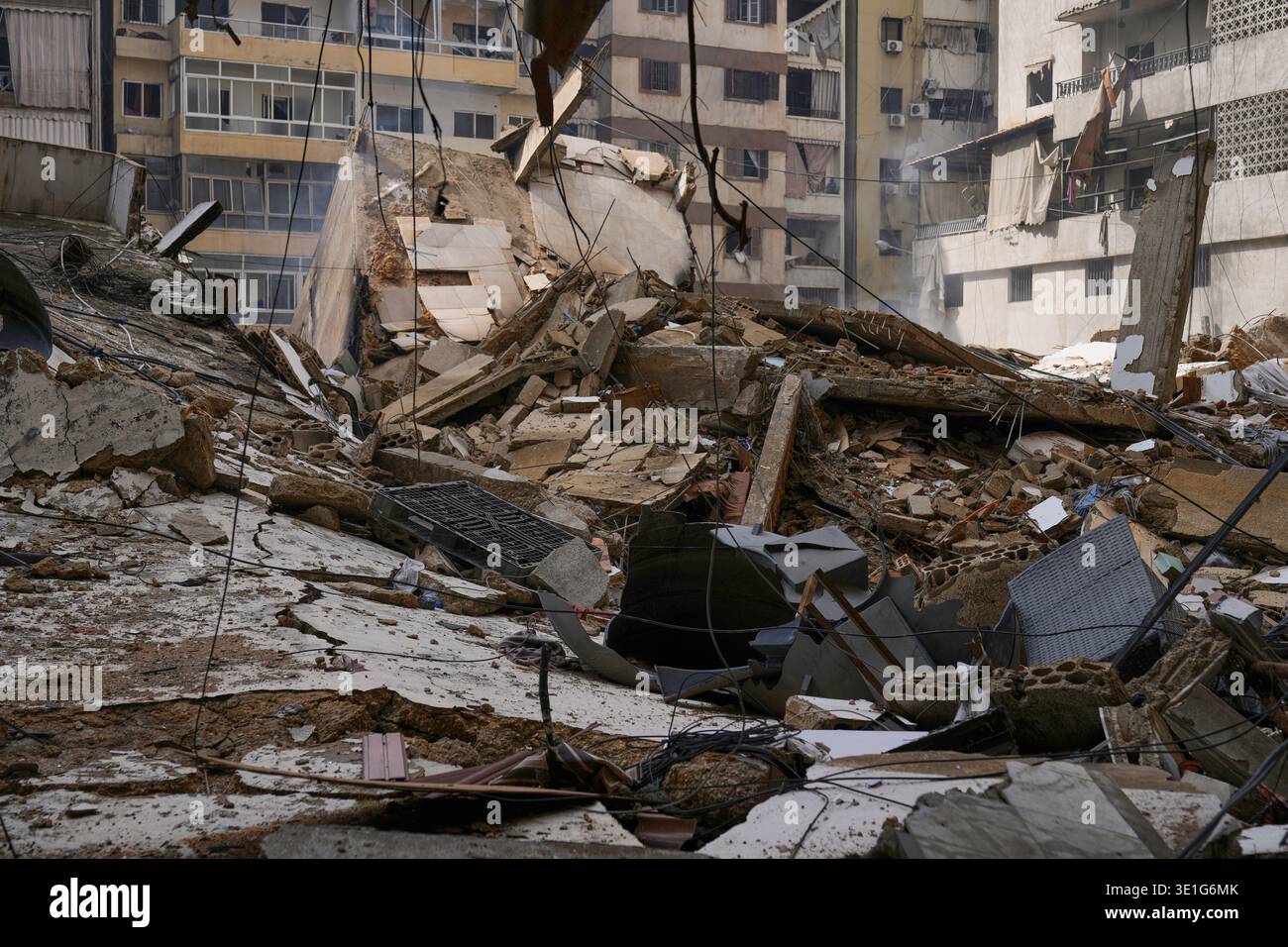 Debris litters a street from buildings damaged in an Israeli airstrike ...