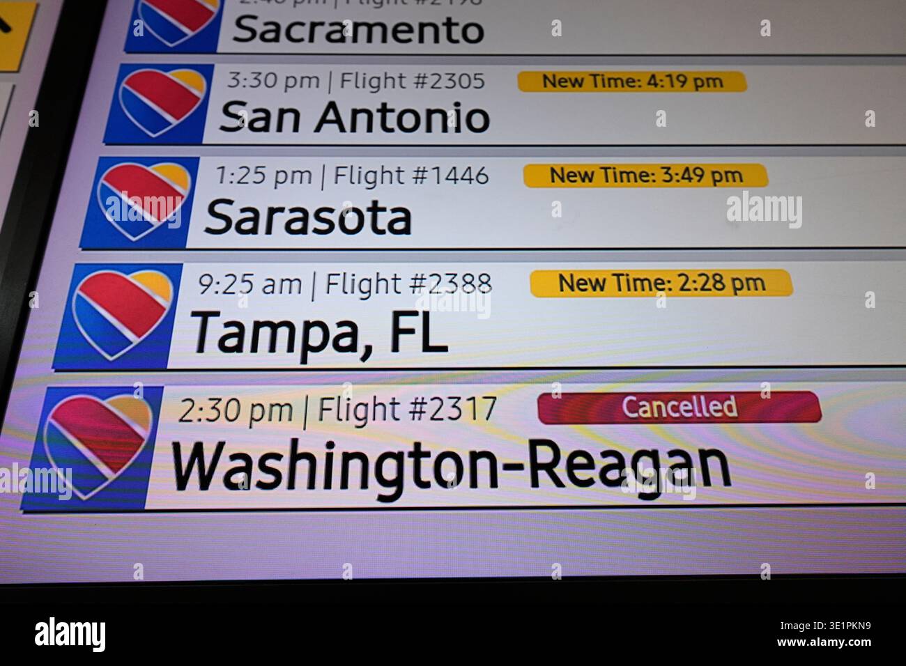 A departure and arrival board gives the status of flight out of Love ...