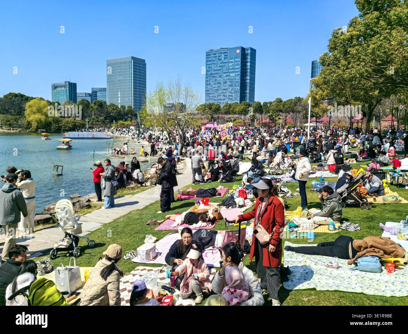 Visitors enjoy a sea of tulips at Daning Park during the Jing'an Flower ...