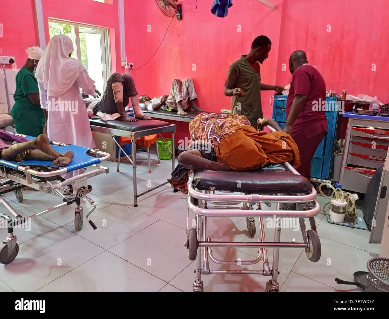 Victims of Monday's bomb blast at a market receives treatment at a ...