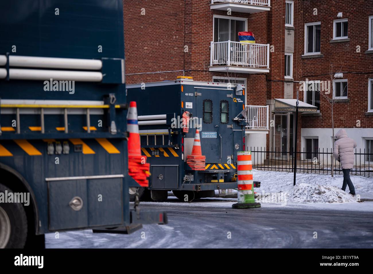Hydro Quebec trucks are seen after strong winds caused power outages ...