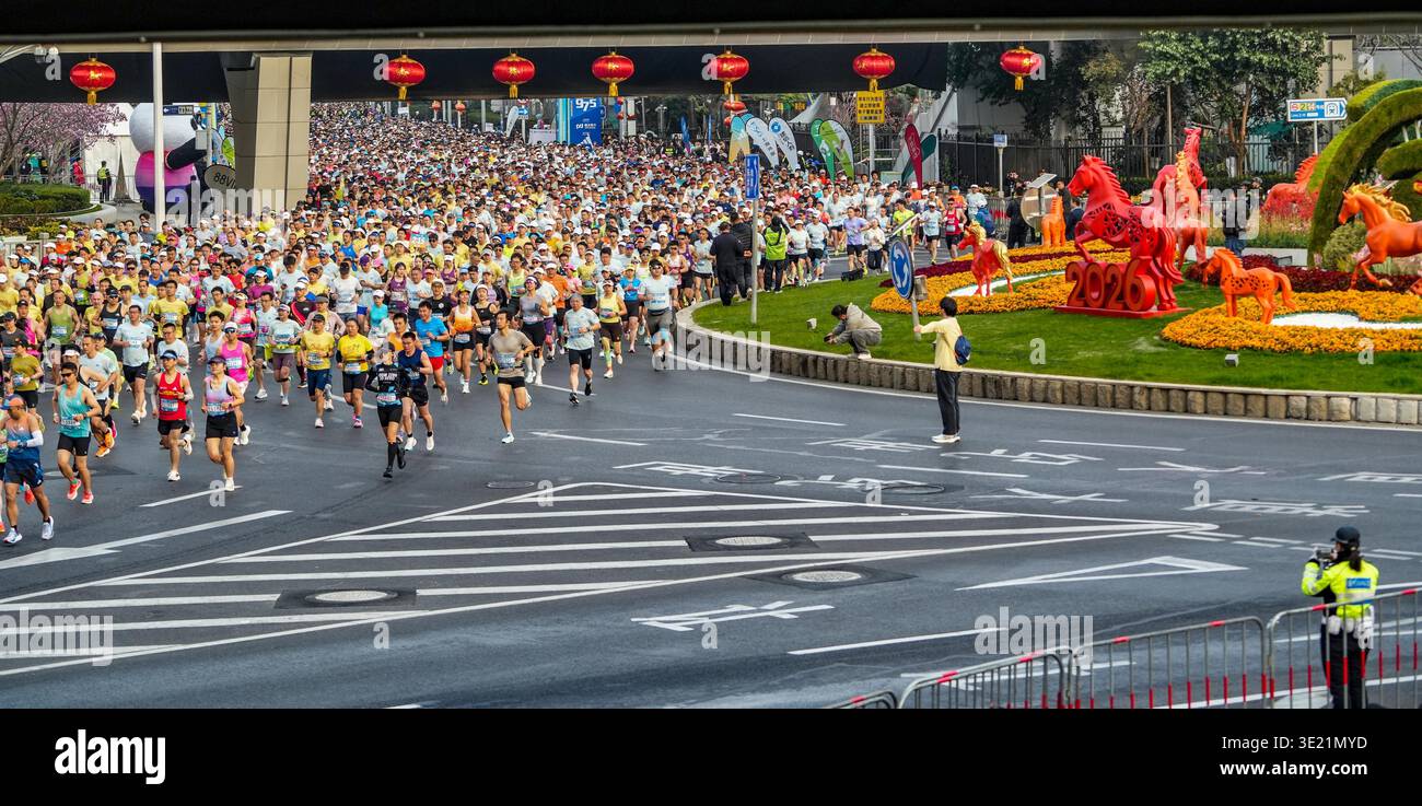 Runners compete in the 2026 Shanghai Half Marathon in Shanghai, China ...