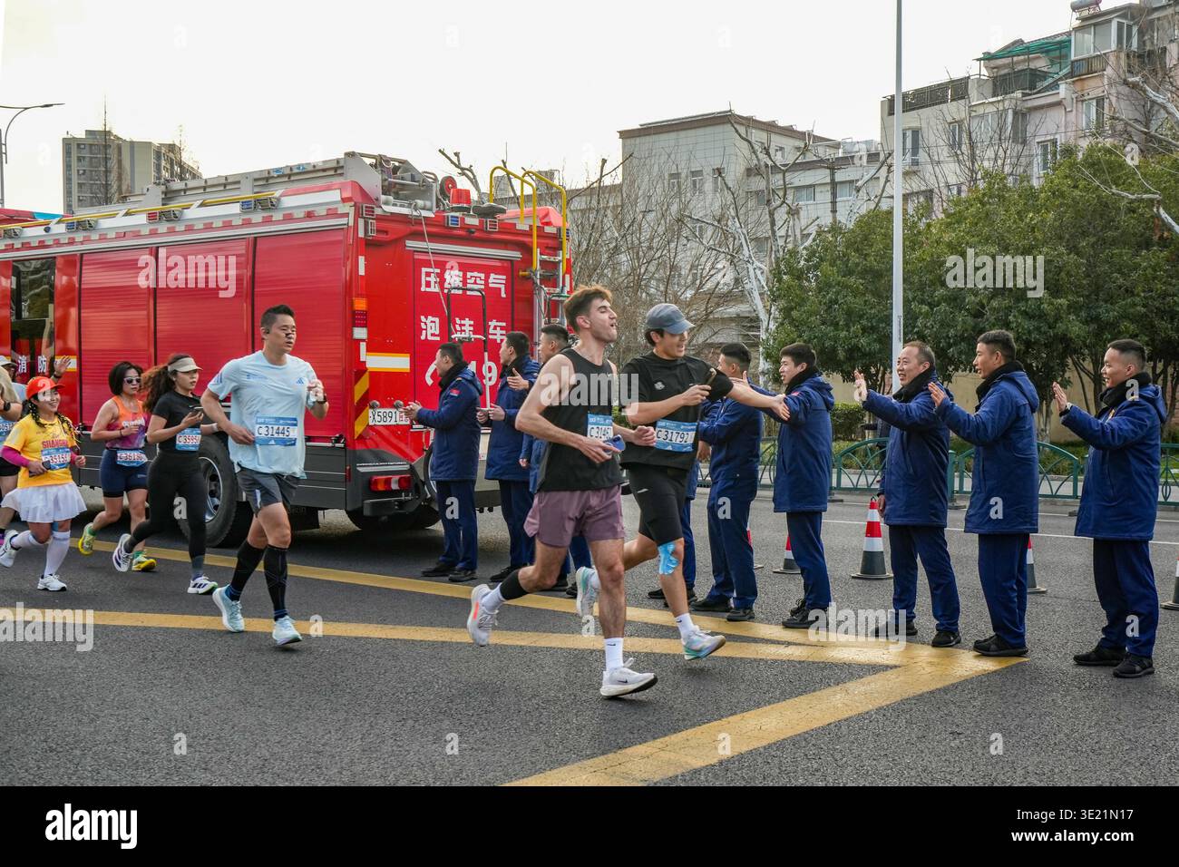 Runners compete in the 2026 Shanghai Half Marathon in Shanghai, China ...