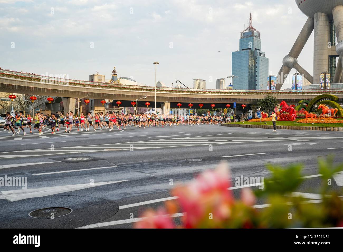 Runners compete in the 2026 Shanghai Half Marathon in Shanghai, China ...