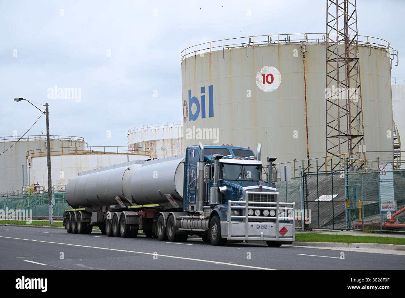 A truck transporting petroleum fuel passes the ExxonMobil Yarraville ...
