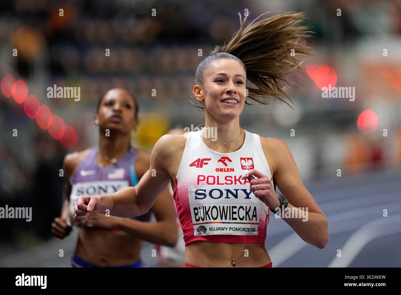 Natalia Bukowiecka, of Poland, reacts after crossing the finish line ...