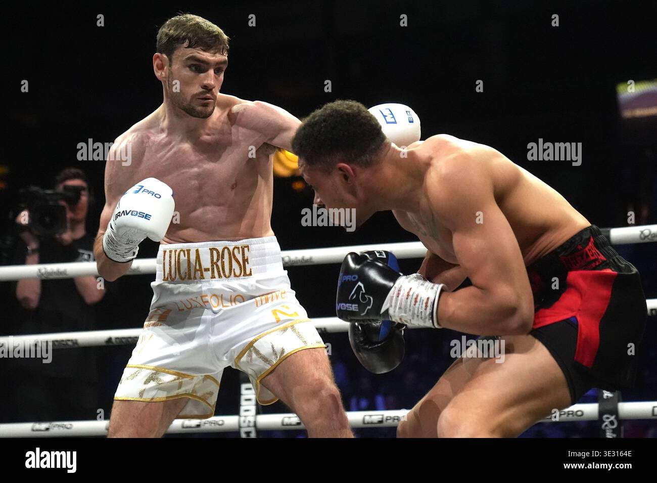 Jak Corrie (left) in action against Jacob Quinn during the Super welter ...