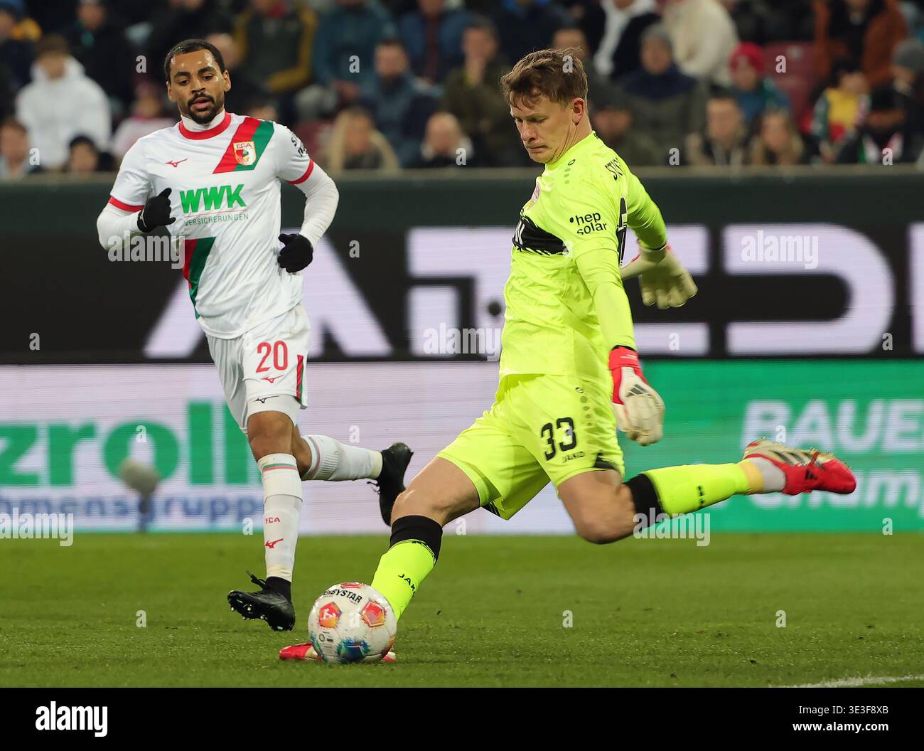 Augsburg, Germany. 22nd Mar, 2026. Alexander Nuebel (R) goalkeeper of ...