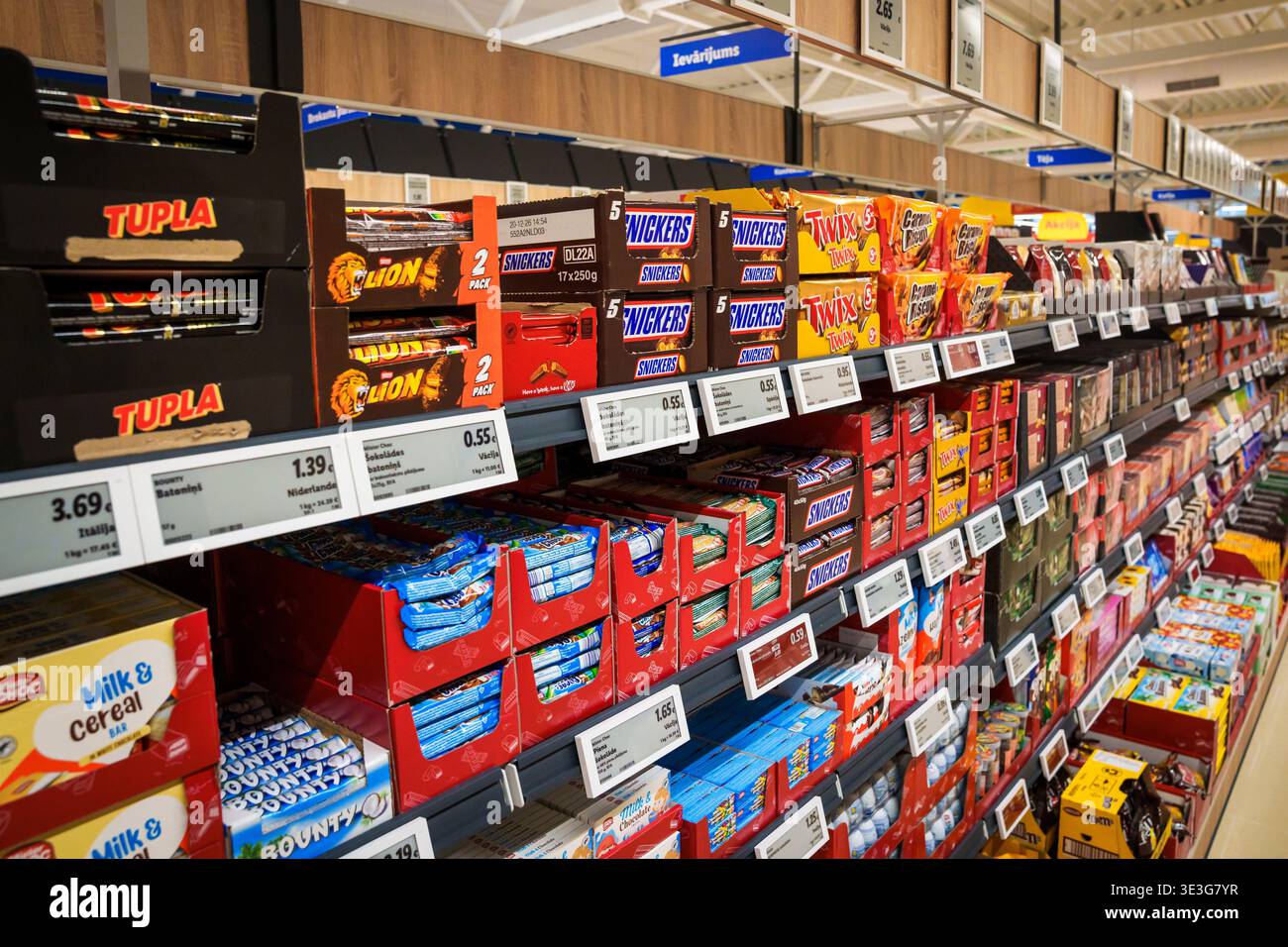 RIGA, LATVIA. 12th March 2026. Assorted chocolate bars and snacks on ...