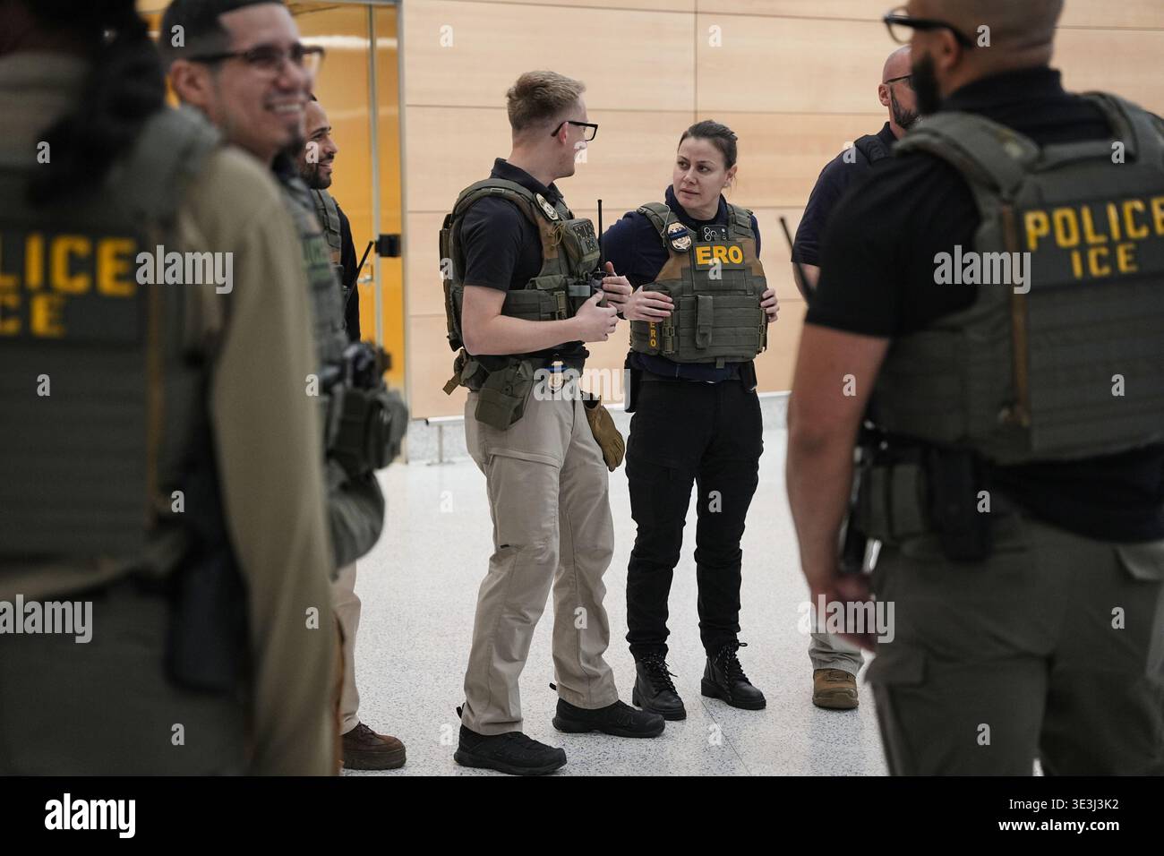 Federal immigration agents are seen at Newark Liberty International ...