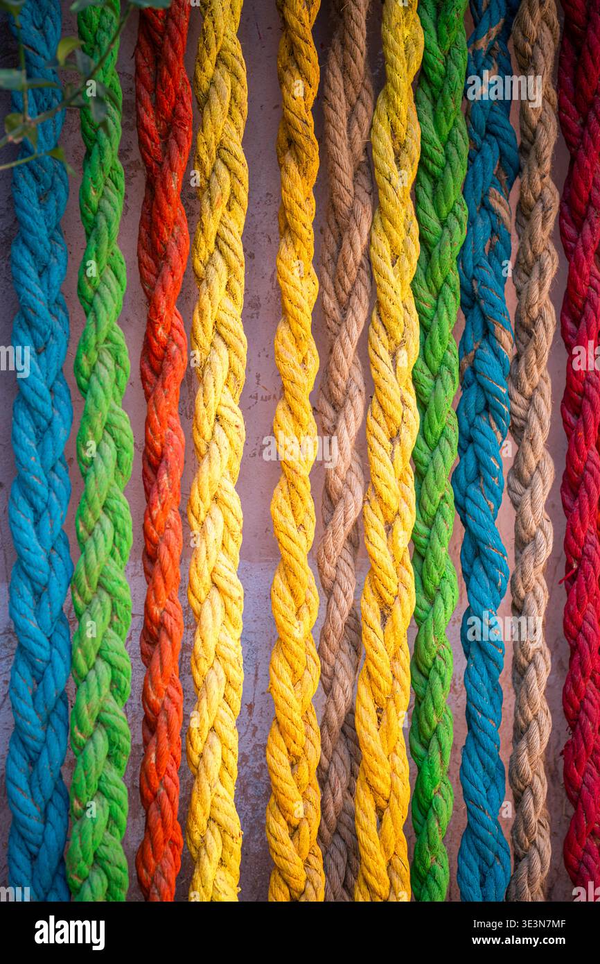 Multi colored knots as a house decoration on the wall of the house in ...