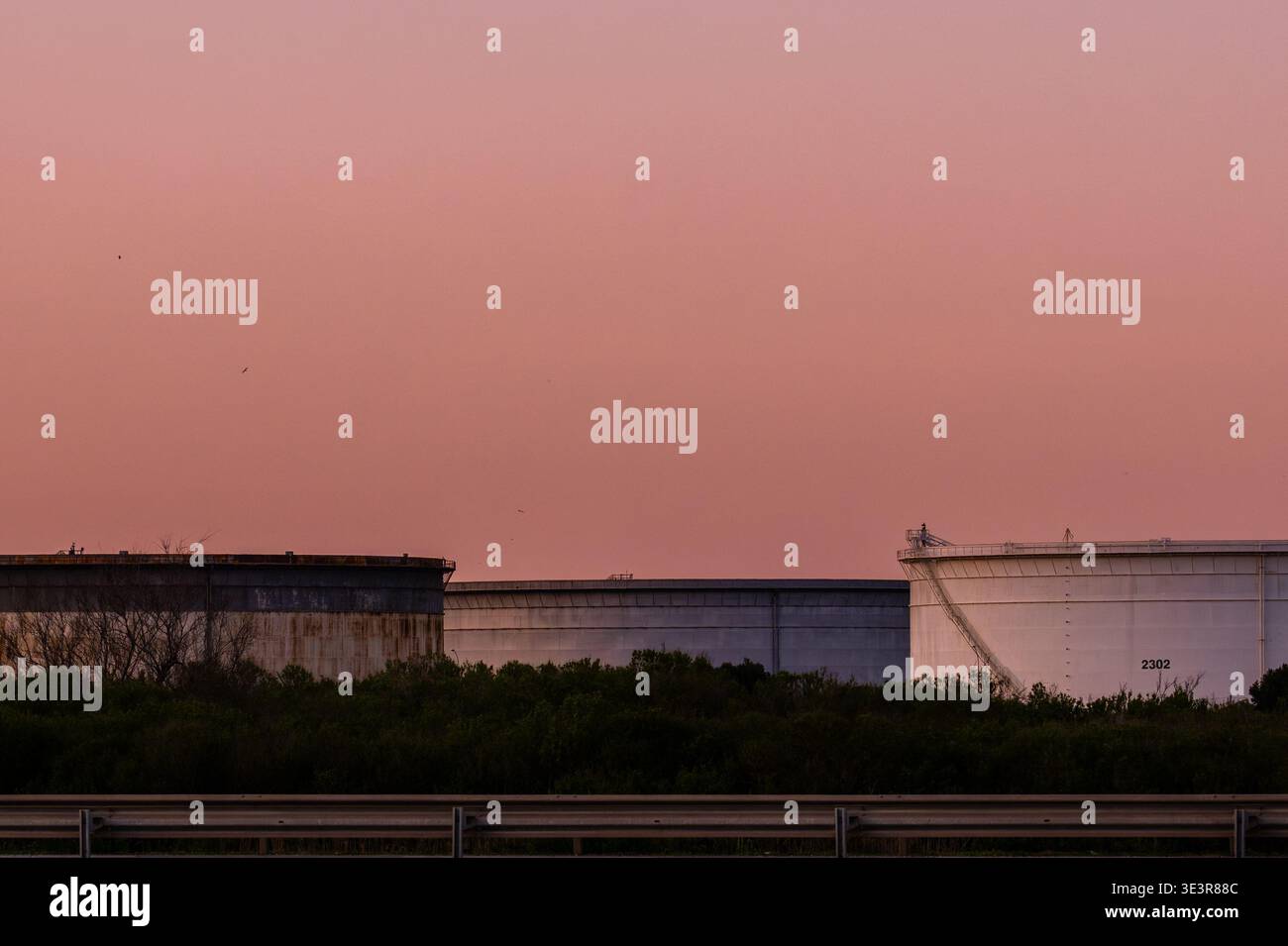 At sunset, a view of the petrochemical complex and the oil port from ...