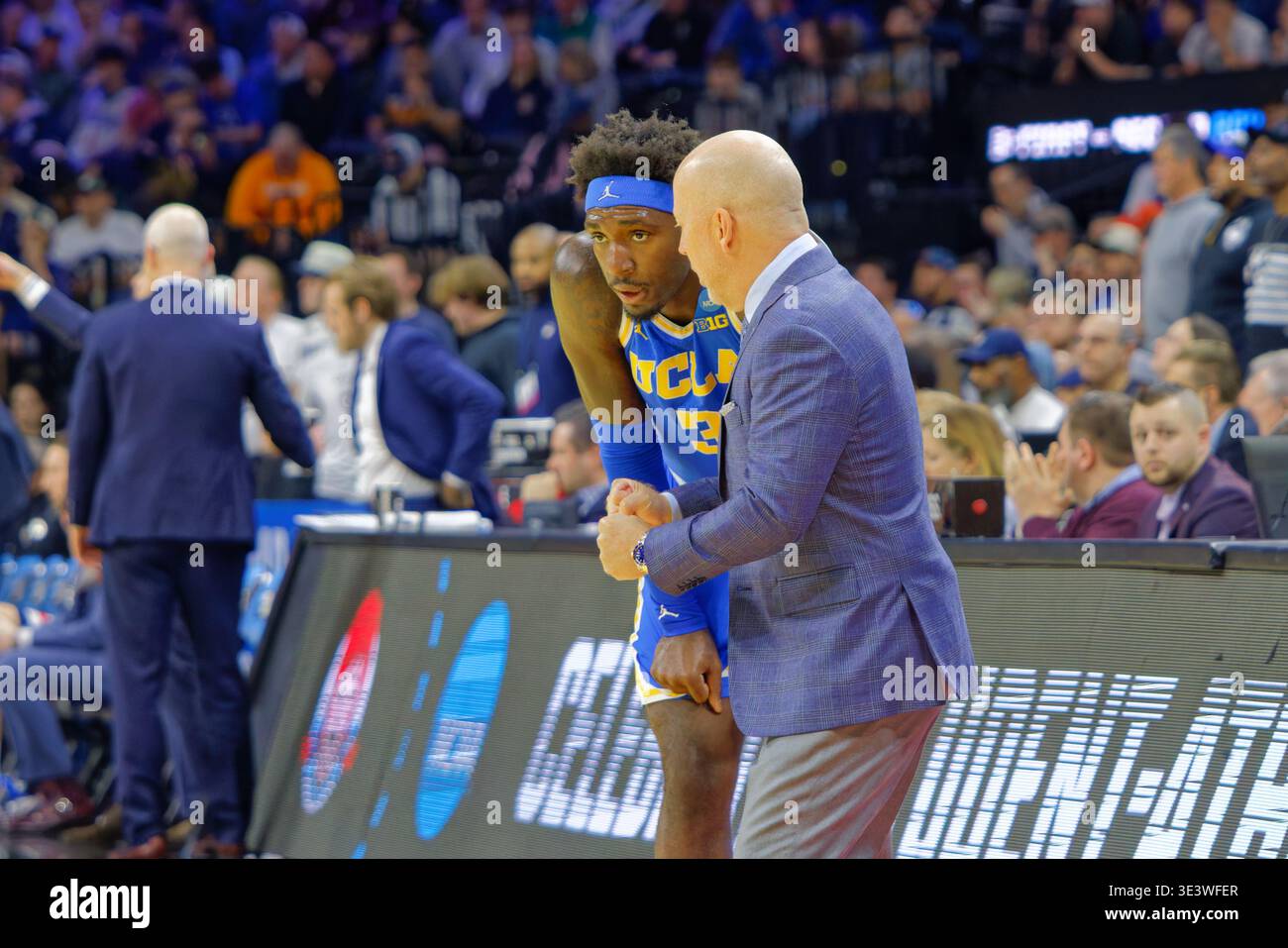 UCLA Guard/Forward Eric Dailey Jr. (3) talks with UCLA head coach Mick ...