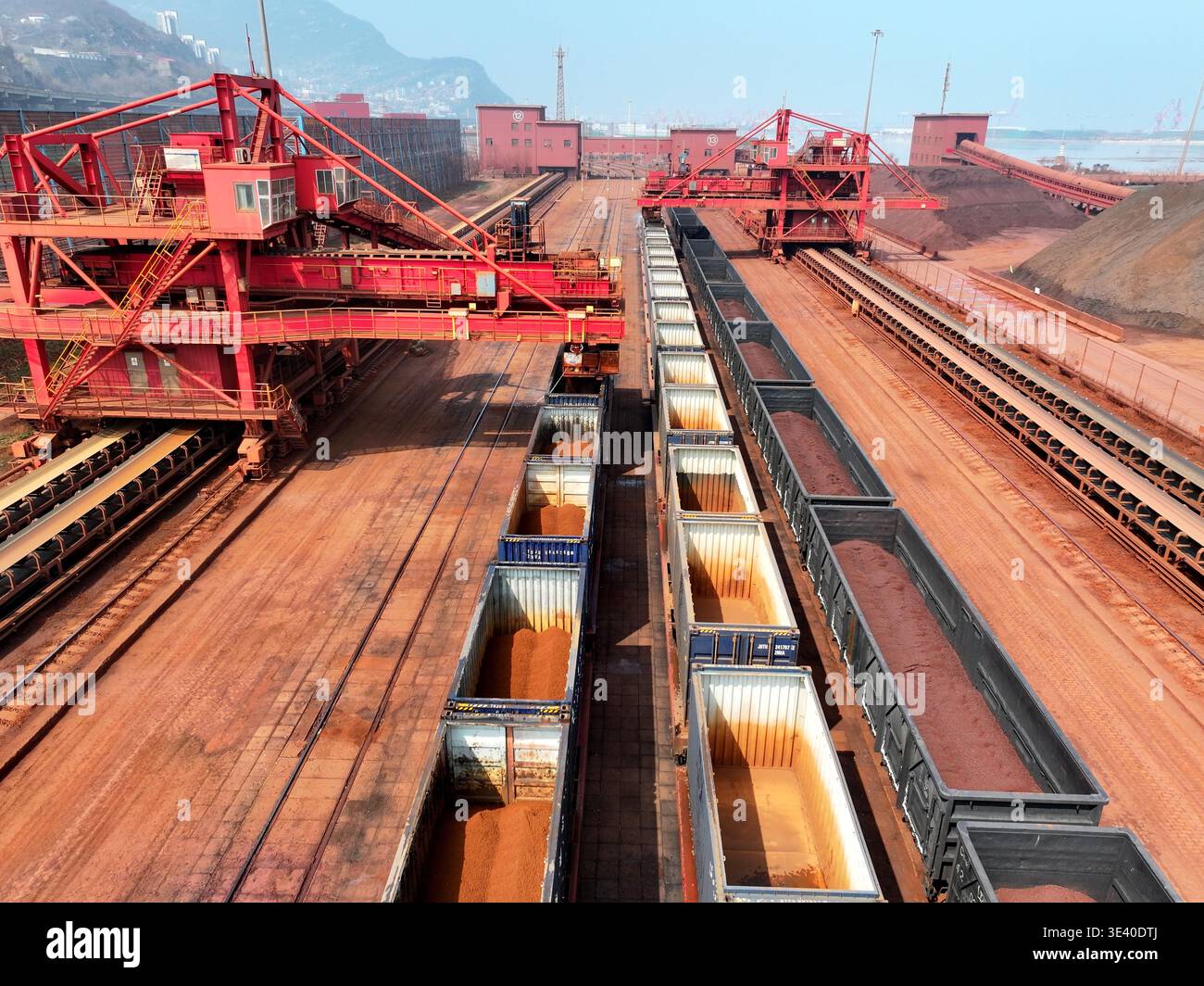 Trains transport imported iron ore at Xinsu Port Terminal in ...