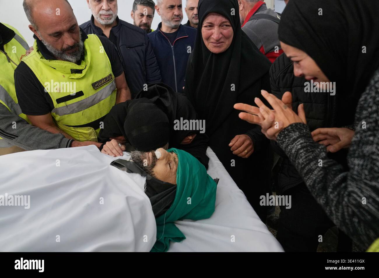 Family members of a paramedic who was killed in an Israeli airstrike ...