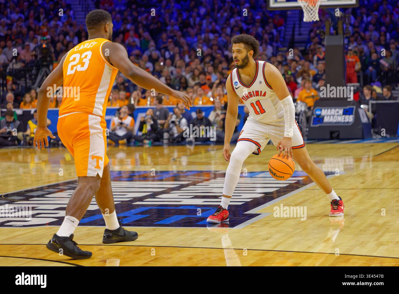 Virginia Forward Devin Tillis (11) dribbling, guarded by Tennessee ...