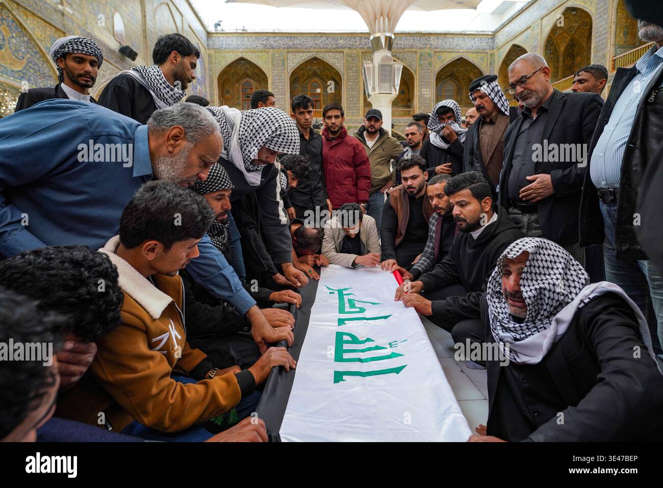 Relatives grieve an Iraqi soldier killed in a strike Wednesday on a ...