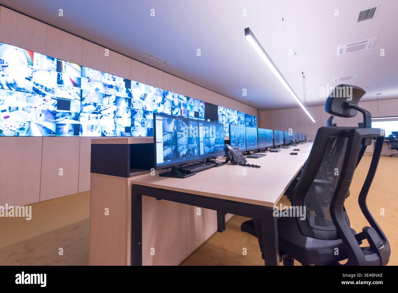 Modern security operations center with multiple workstations and large ...