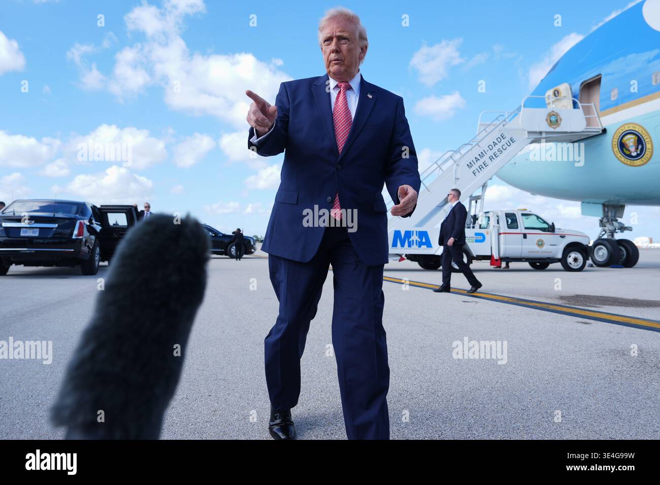 President Donald Trump speaks to reporters after stepping off Air Force ...