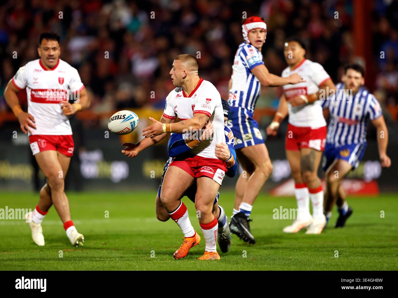 Hull KR's Mikey Lewis offloads the ball during the Betfred Super League ...
