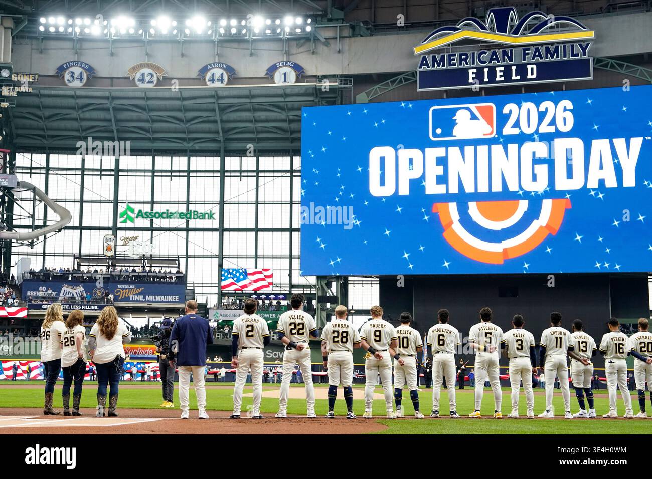 The Milwaukee Brewers stand for the singing of the national anthem ...