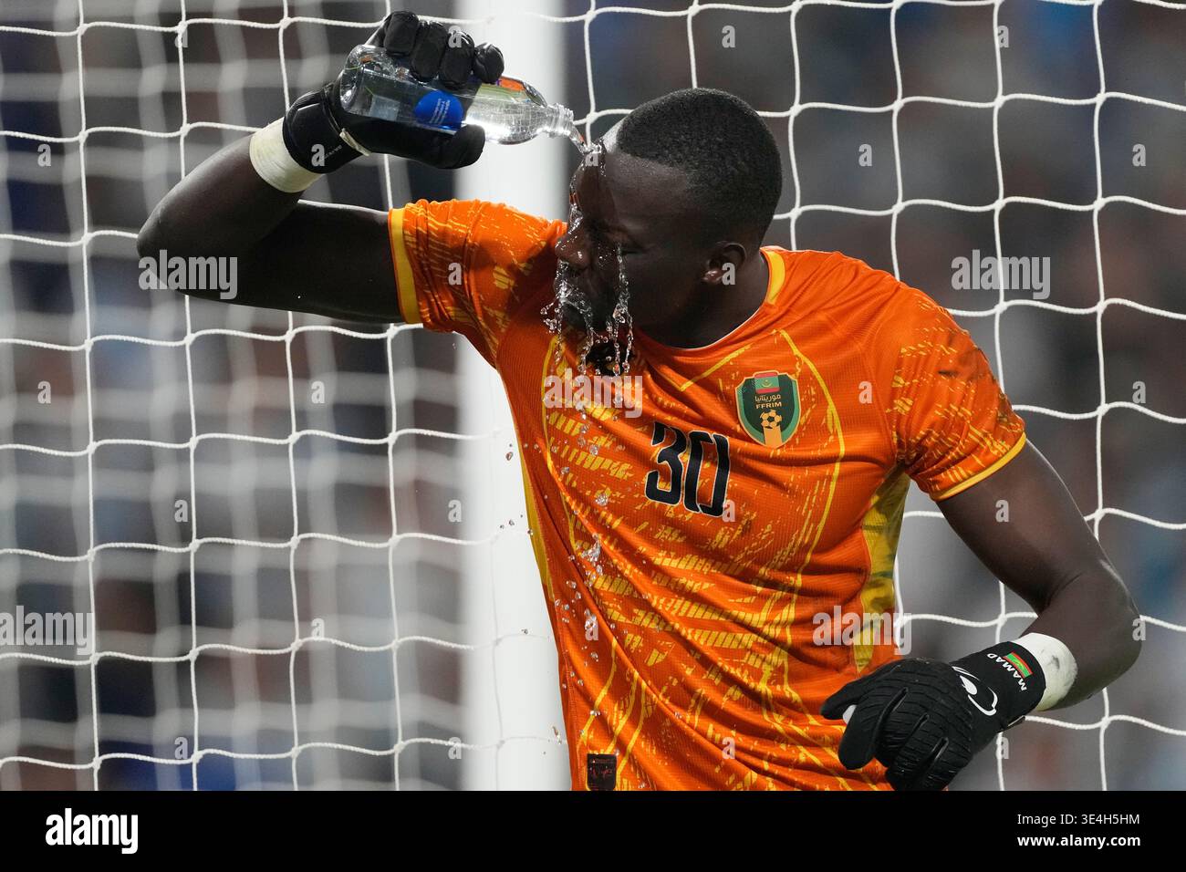 Mauritania's goalkeeper Mamadou Diop refreshes during a friendly soccer ...