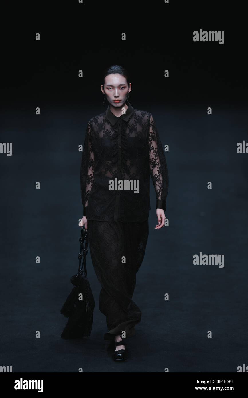 A model walks the runway at the A.1 Fashion Changes Life show by ...