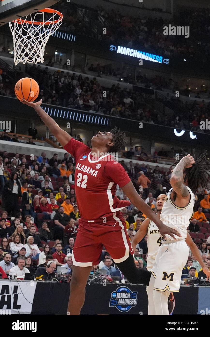 Alabama's Aiden Sherrell (22) heads to the basket past Michigan's ...