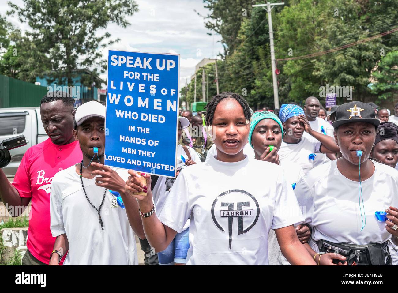 An activist holds a placard during a protest against rising social ...