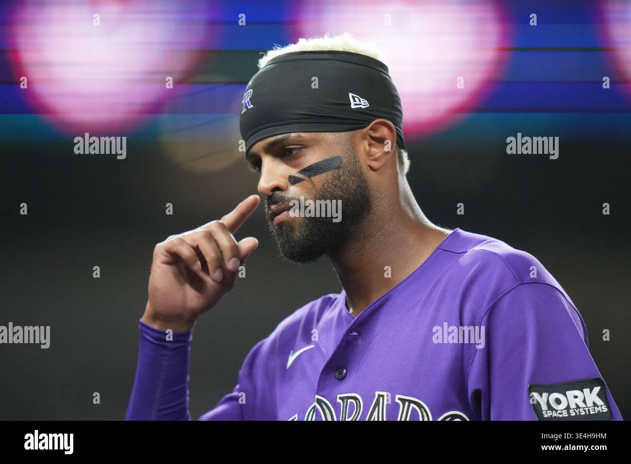 Colorado Rockies' Willi Castro walks to the dugout after he struck out ...