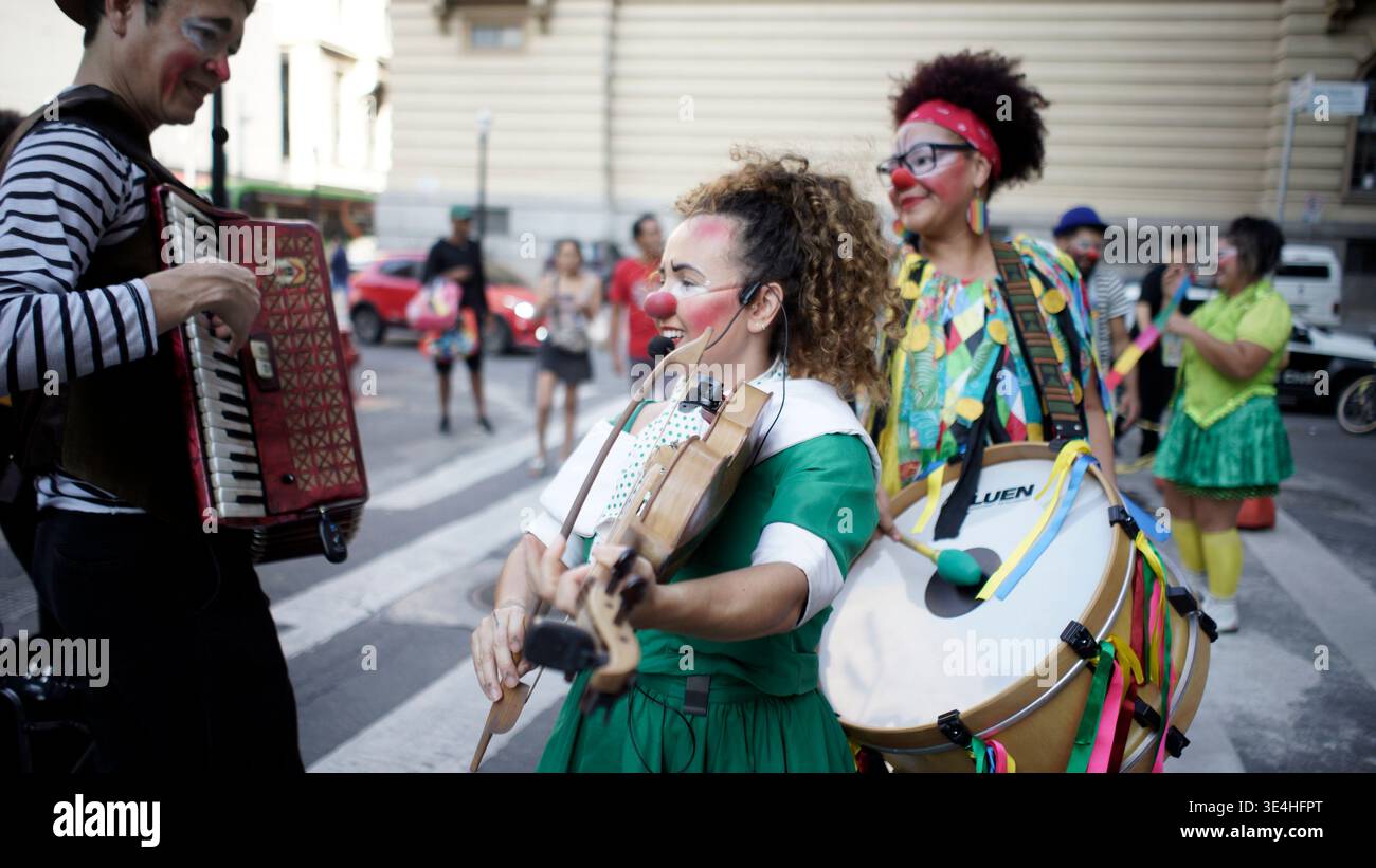 The artists participate in a parade as part of the celebration of ...