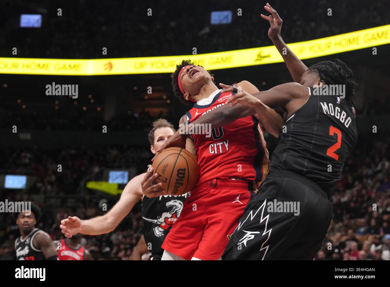 New Orleans Pelicans' Jeremiah Fears (0) is fouled by Toronto Raptors ...