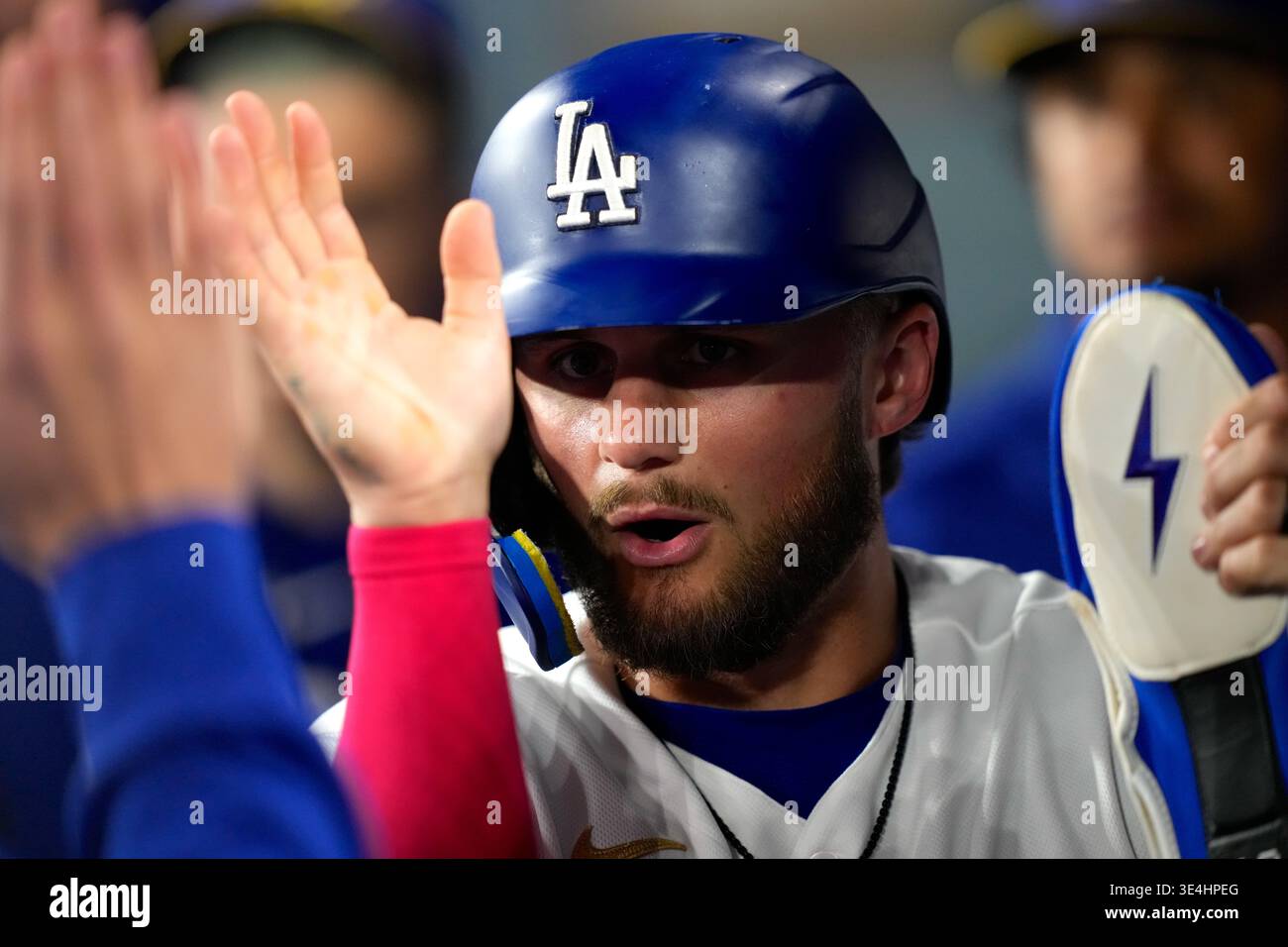 Los Angeles Dodgers' Alex Freeland is congratulated by teammates in the ...