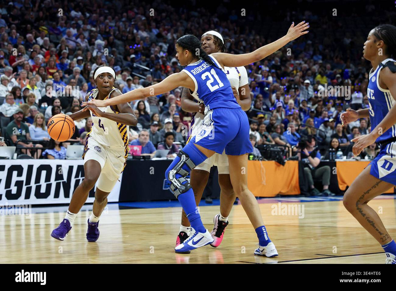 LSU guard Flau'jae Johnson (4) drives to the basket with Duke center ...