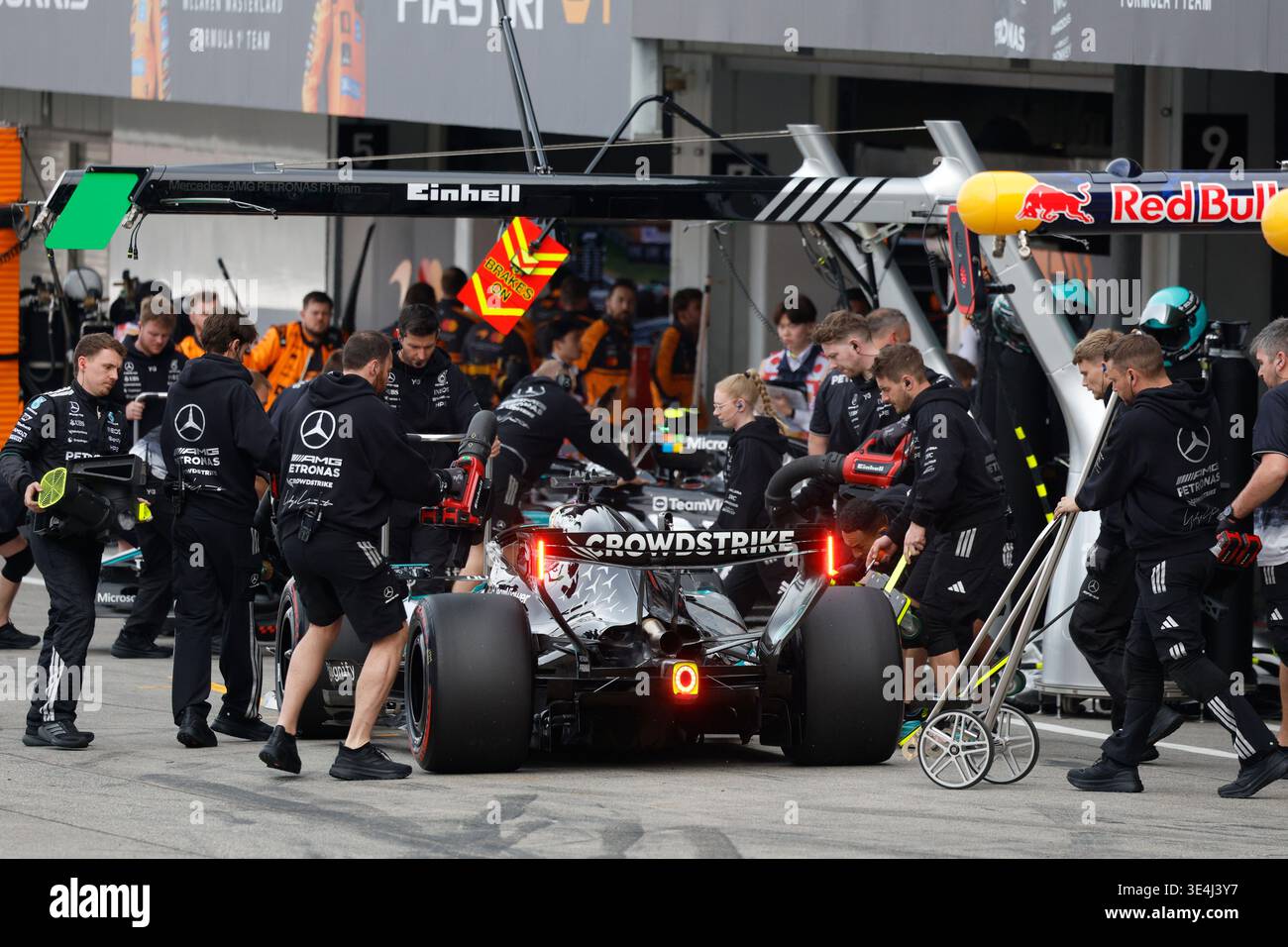 Mercedes driver George Russell of Britain gets a pit service during the ...