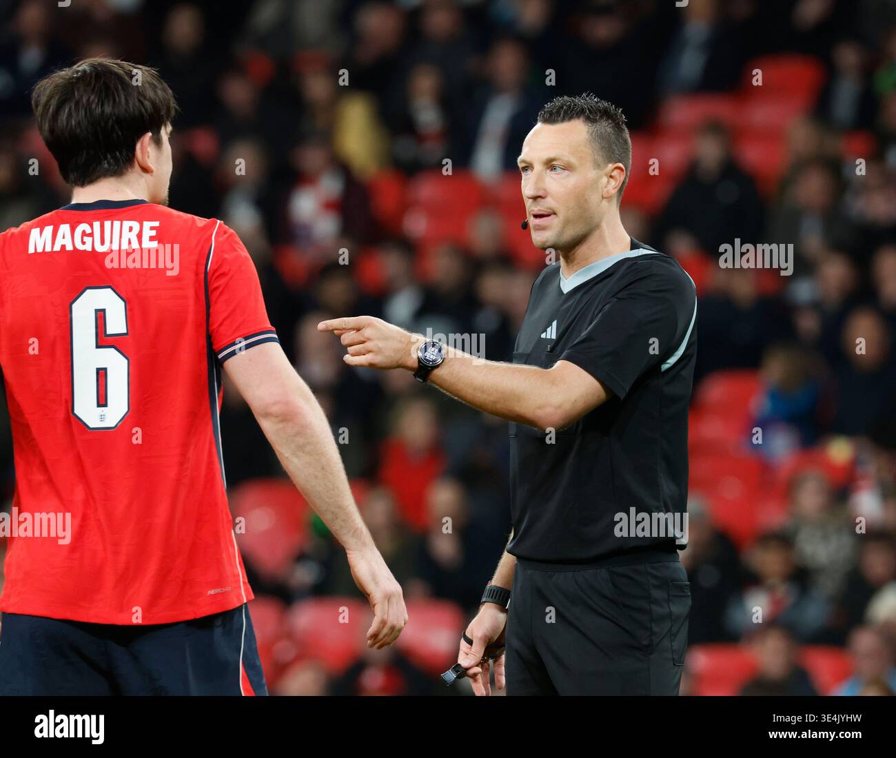 Referee Sven Jablonski having words with England Harry Maguire ...