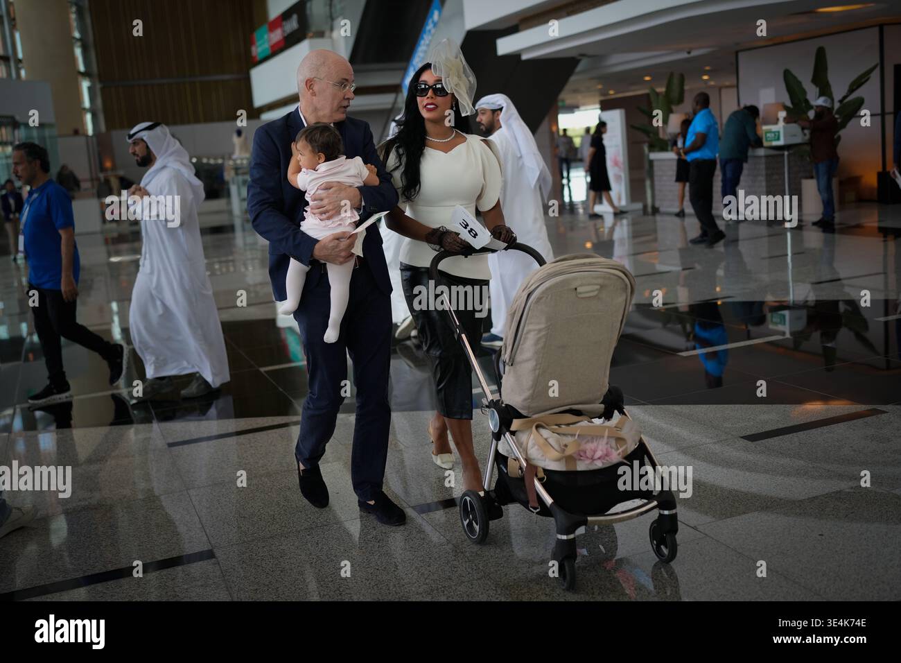 Racegoers arrive at the grandstand ahead of the Dubai World Cup at ...