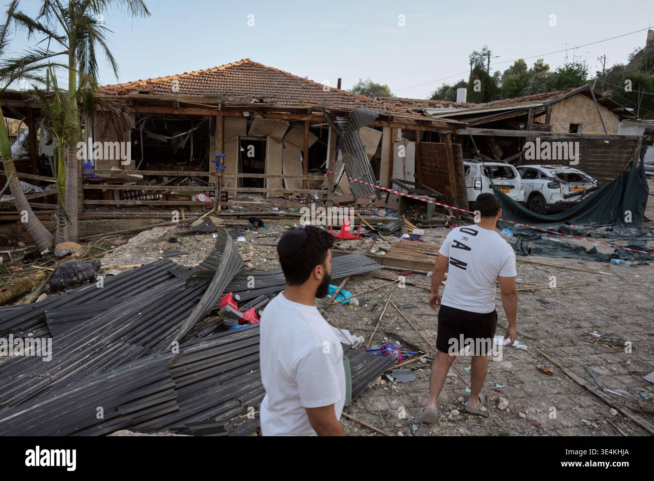 Residents inspect a house after it was struck by an Iranian missile in ...