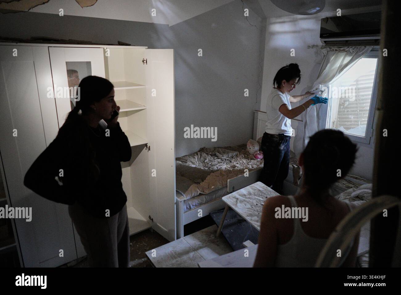 Residents inspect their home after it was struck by an Iranian missile ...