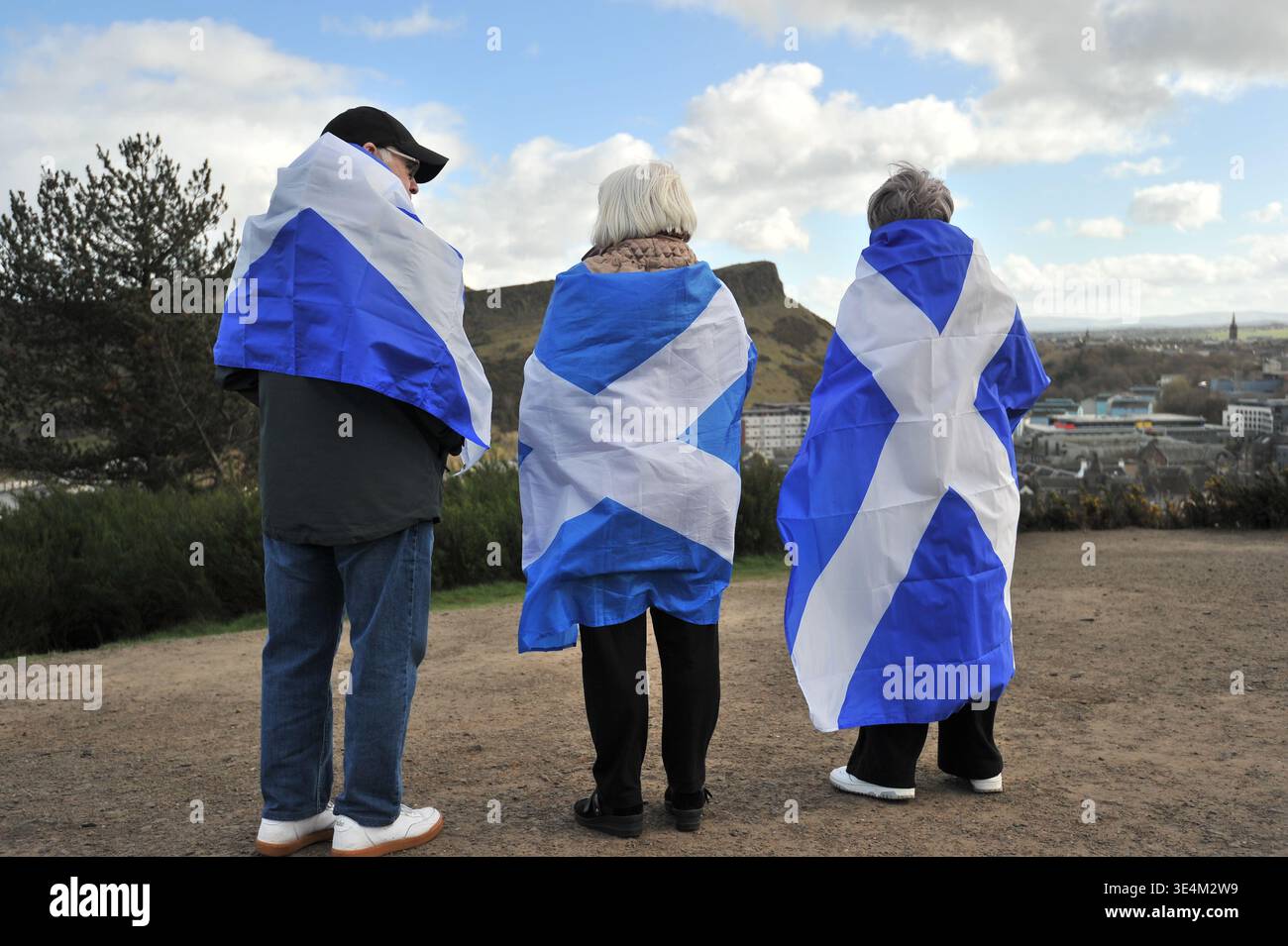 Edinburgh, UK. 28th March, 2026. A trio of supporters are seen wearing ...