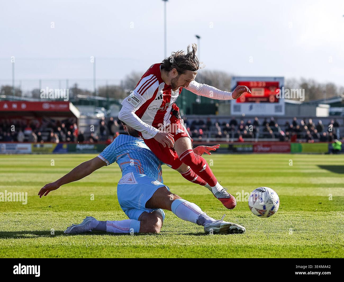 BRACKLEY, ENGLAND - MARCH 28: Stefan Mols of Tamworth FC tackles Morgan ...