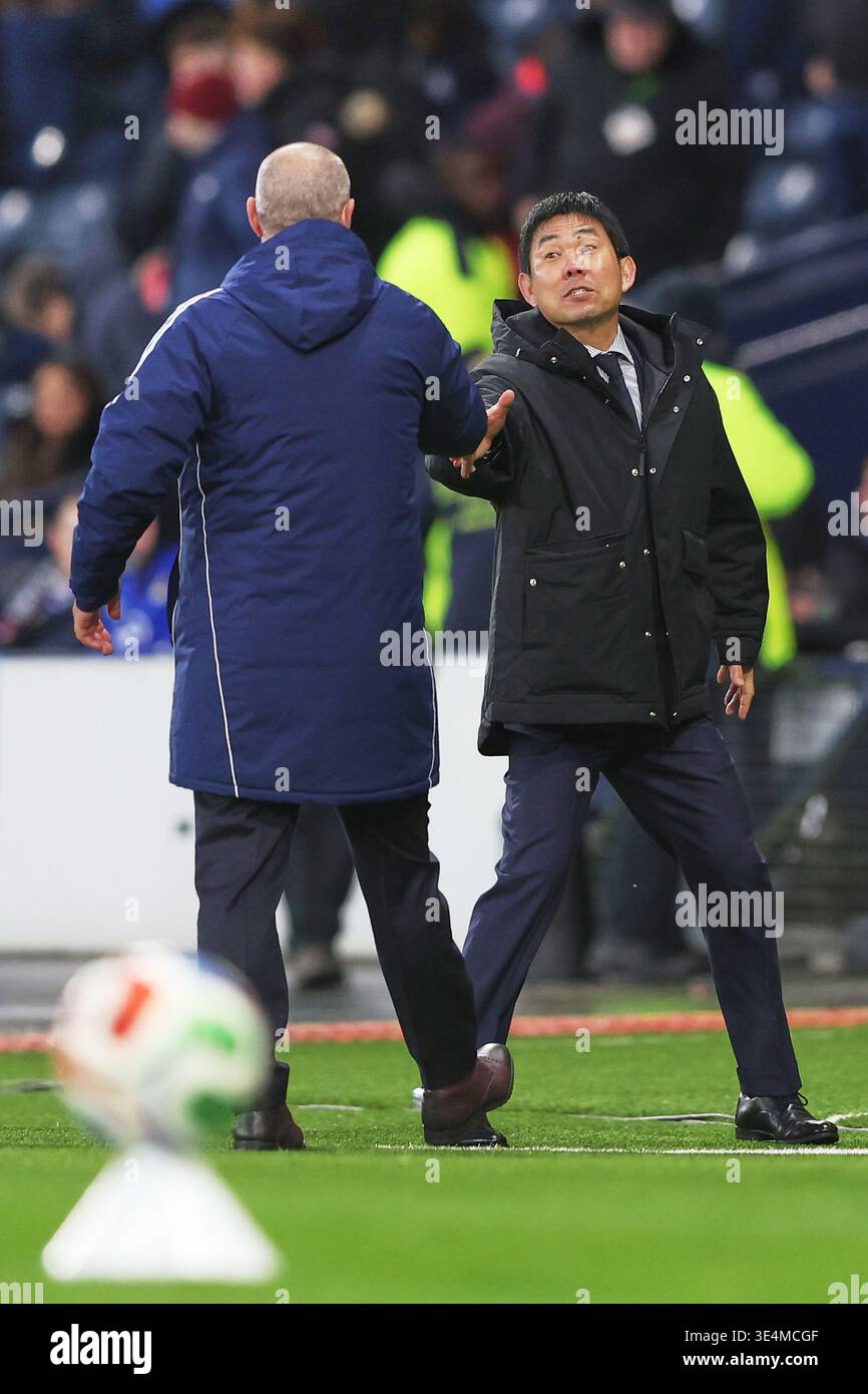 Japan head coach Hajime Moriyasu, right, greets Scotland head coach ...