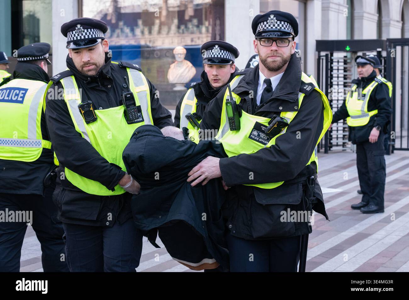 London, UK. 28 March, 2026. A protester is carried to a police van ...